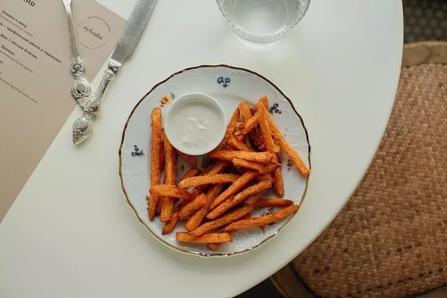 Sweet potato fries with light blue sauce photo # 2