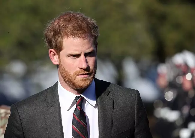 Bhuail an Prionsa Harry le grianghraf # 1 athair Meghan Markle